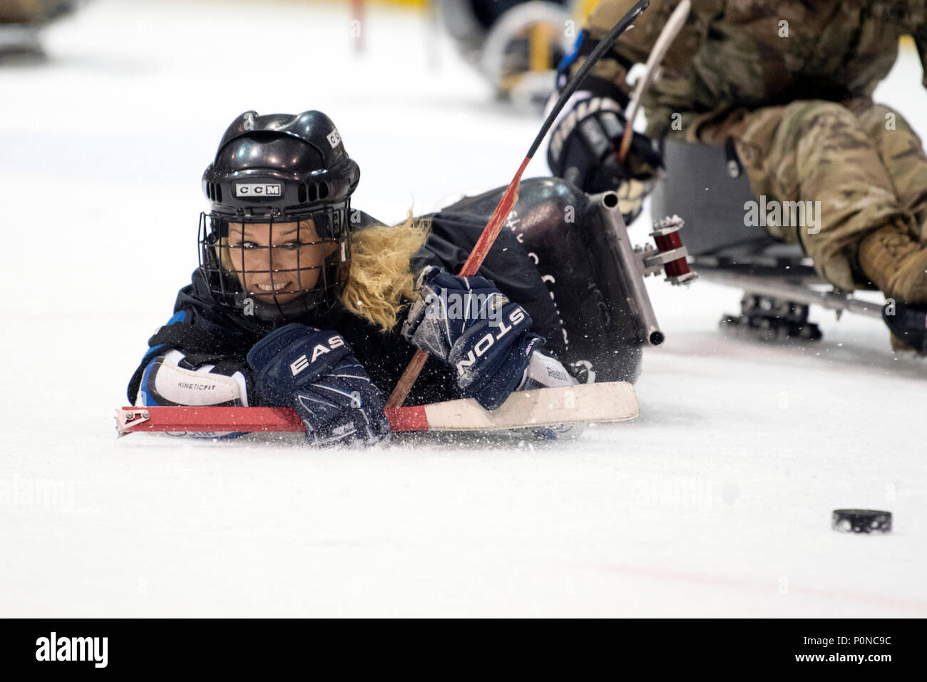 Petty Officer 2nd Class Esther Stevenson falls over while taking a shot ...