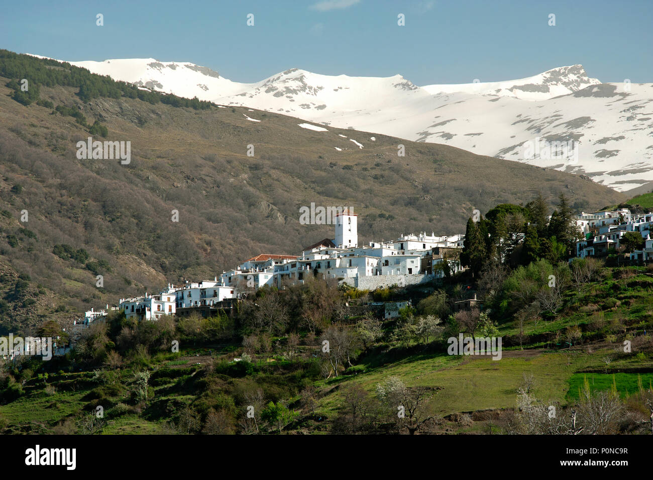 The Alpujarran village of Capileira high up in the snow-capped Sierra ...