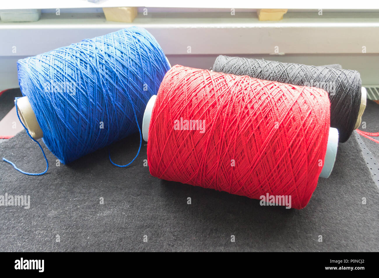 Three sewing bobbins hi-res stock photography and images - Alamy
