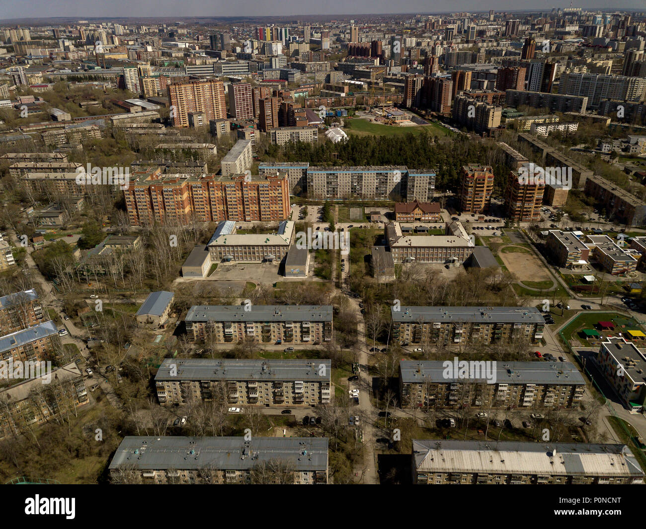 Old and new russian buildings in green area in the cty with a lot of ...