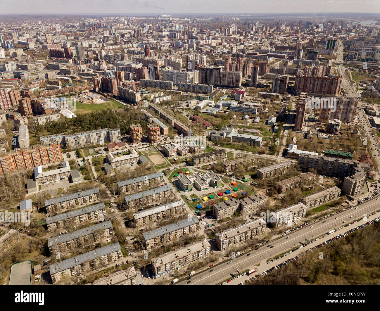 Old and new russian buildings in green area in the cty with a lot of ...