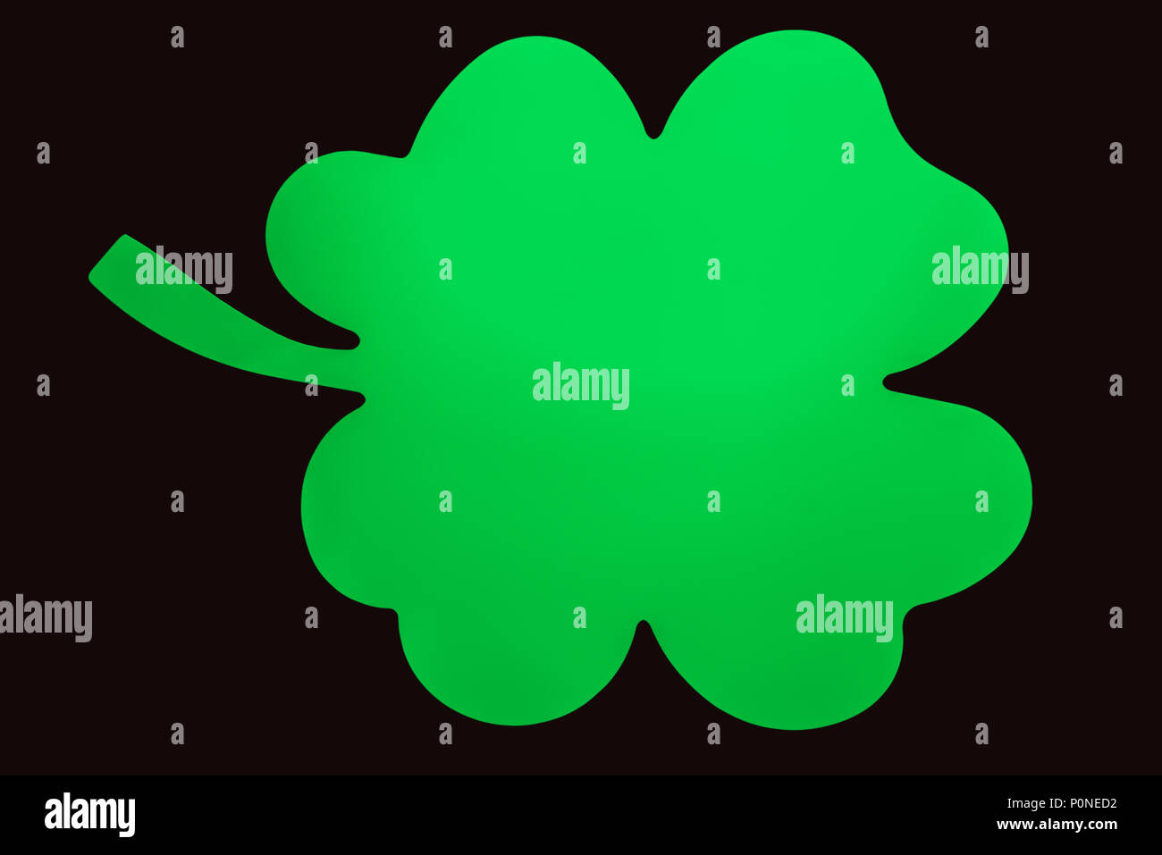 close-up view of green clover symbol isolated on black Stock Photo - Alamy