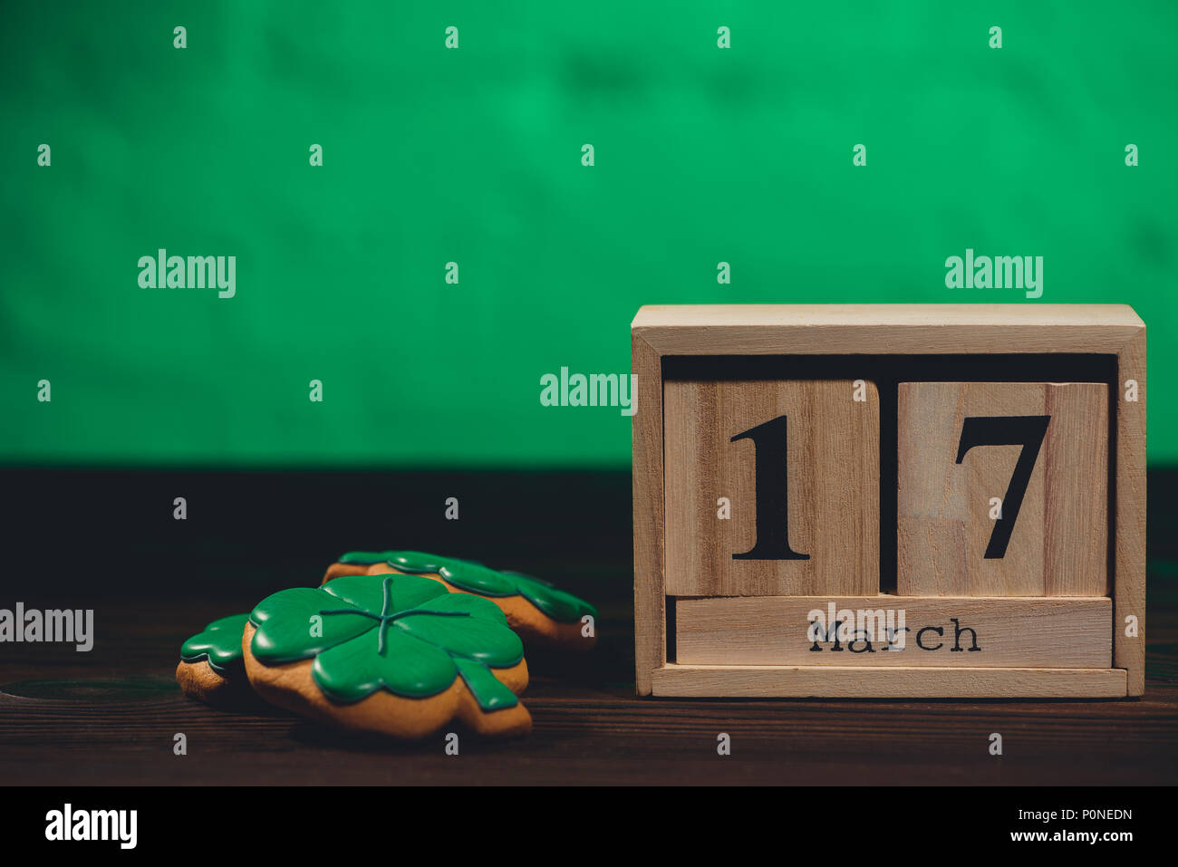 close-up view of calendar with 17 march date and cookies and hsape of ...
