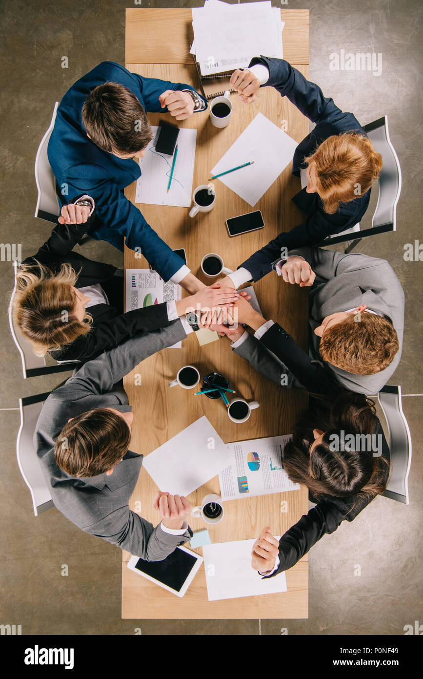Top view of colleagues at table in office, businesspeople teamwork ...