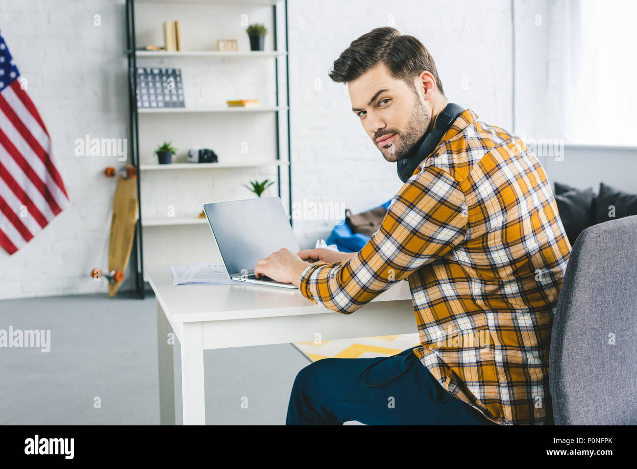 Freelancer working by laptop at home office Stock Photo - Alamy