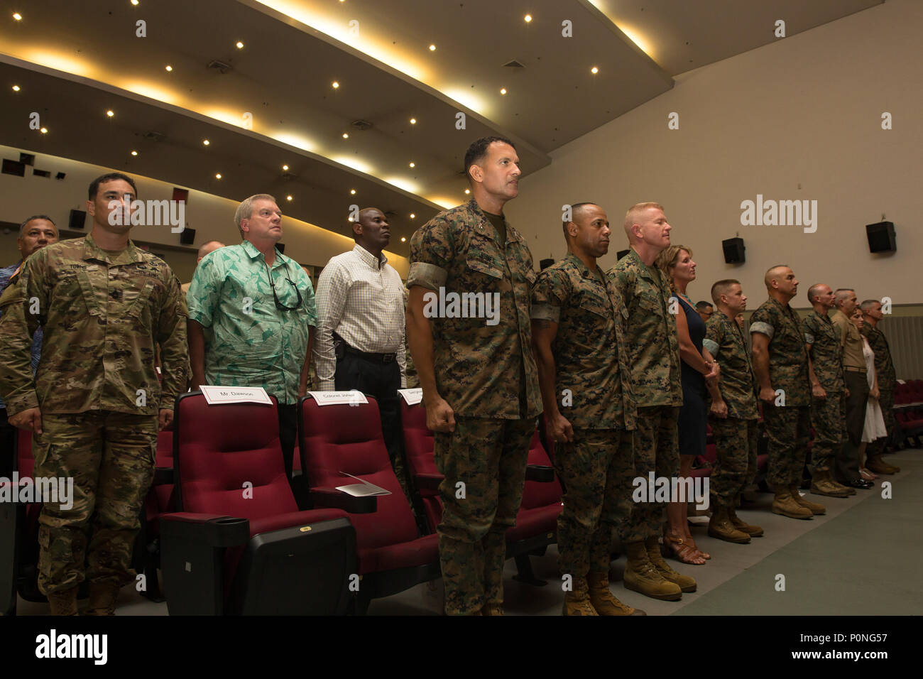 CAMP FOSTER, OKINAWA, Japan- Marines and guest stand for the playing of ...