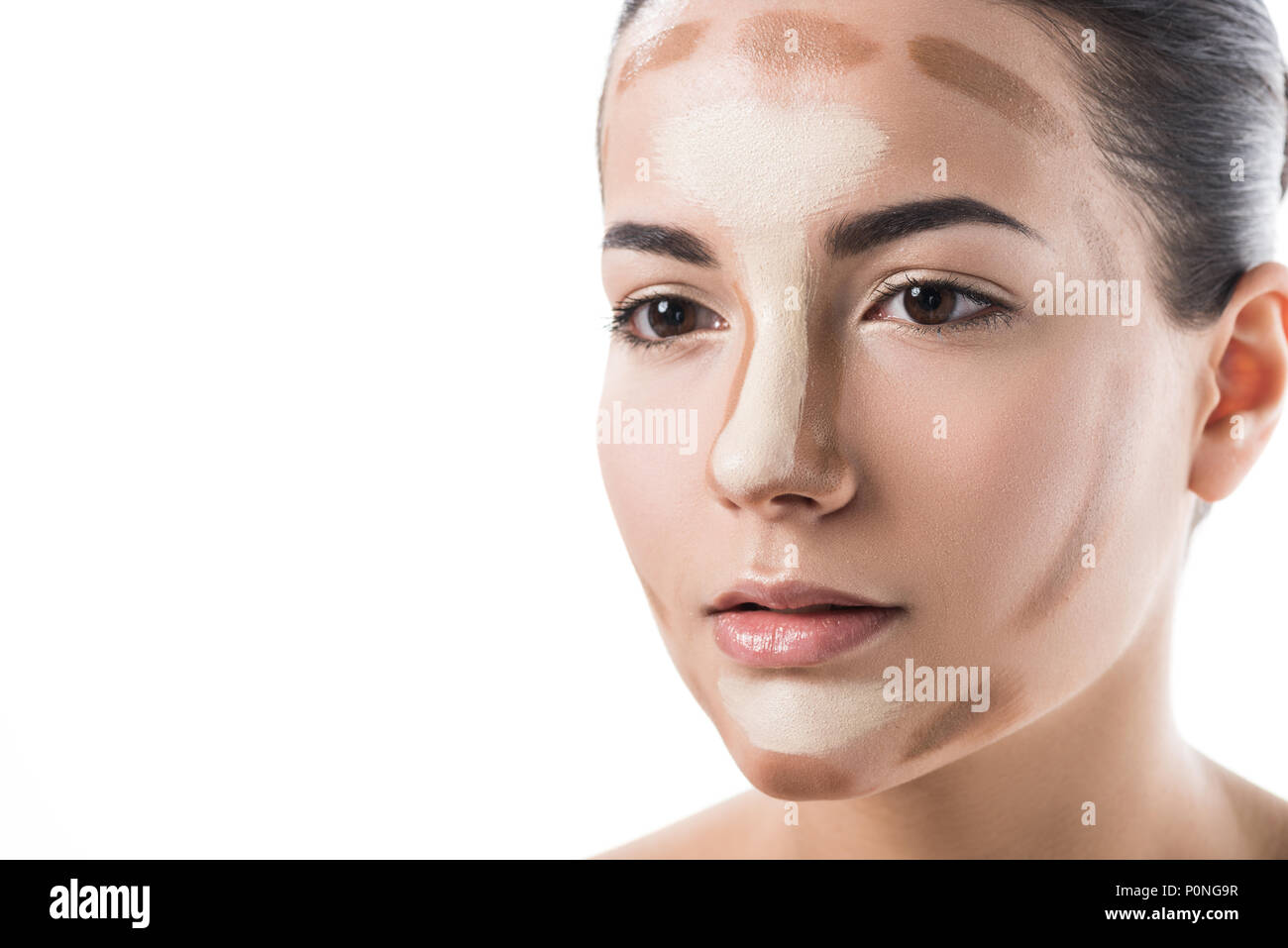 beautiful girl with foundation cream on face looking away isolated on ...