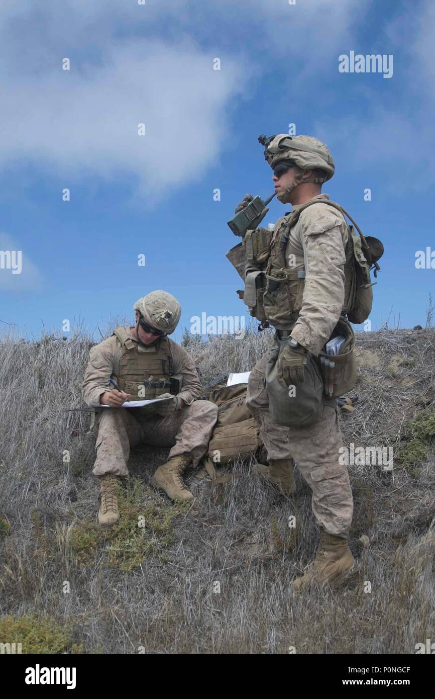 U.S. Marines Lance Cpl. Cory Mason, joint forward observer (left), and ...