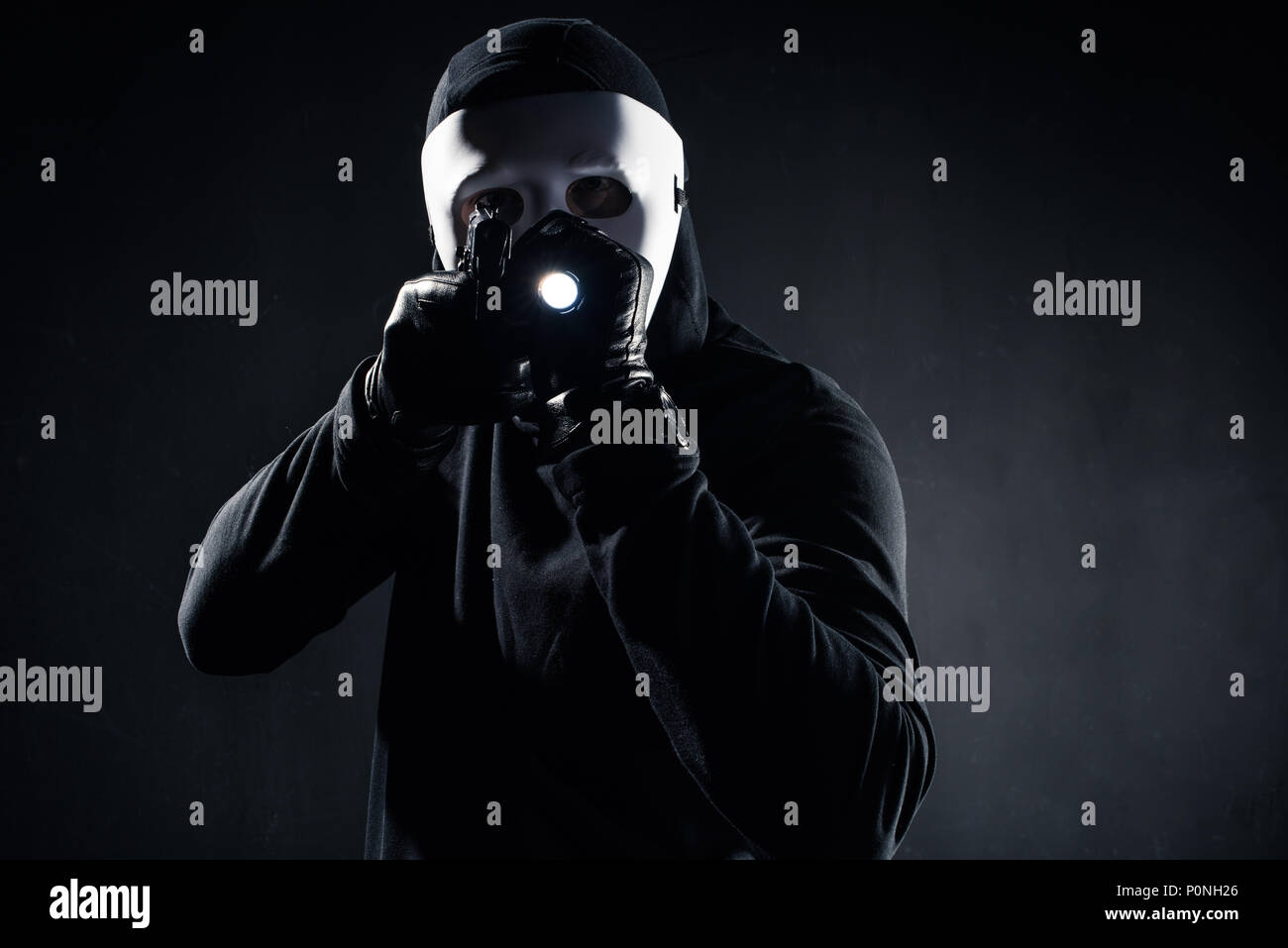 Evil mask man gun hi-res stock photography and images - Alamy