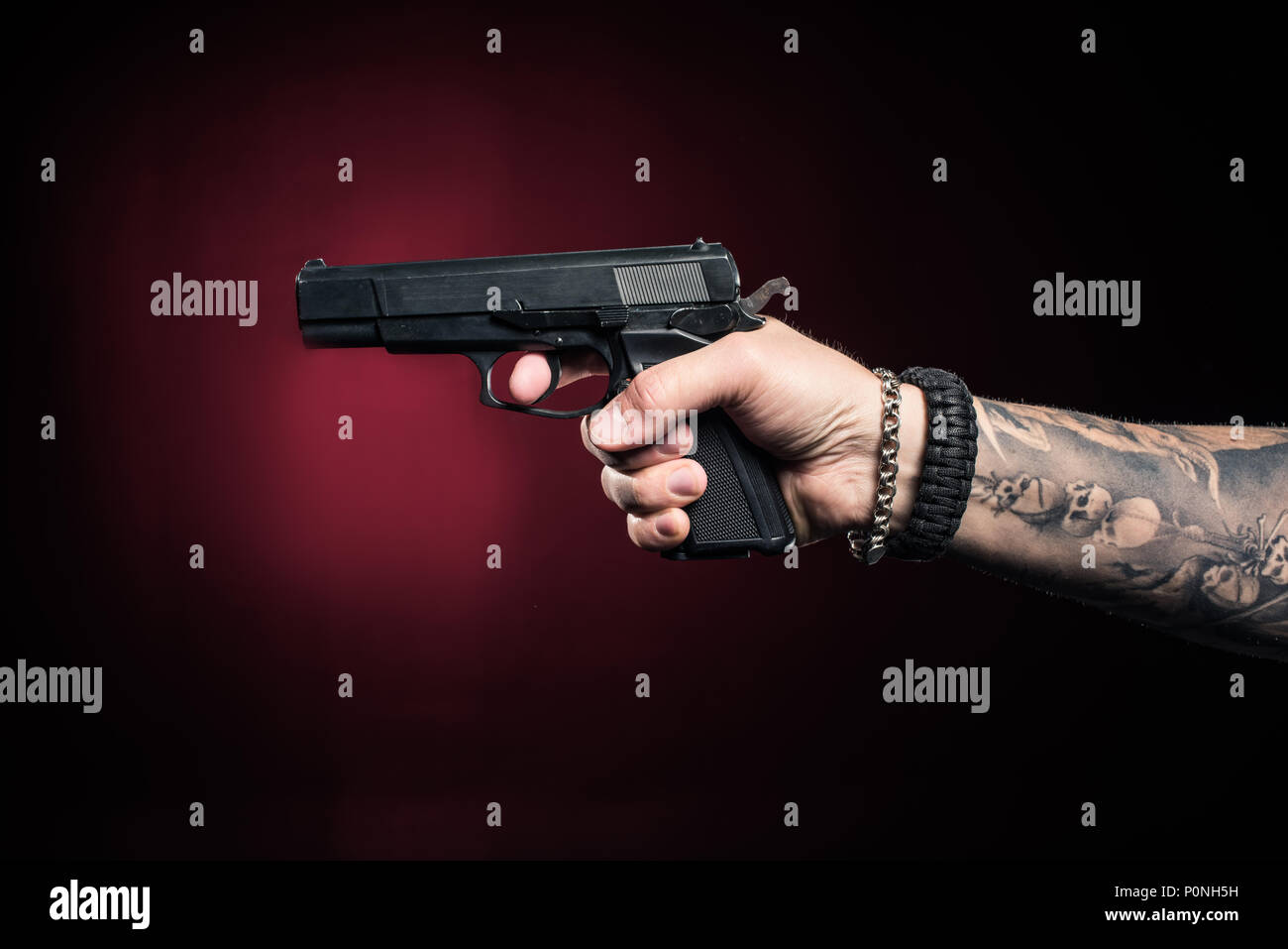 Close-up view of male hand aiming with gun Stock Photo - Alamy