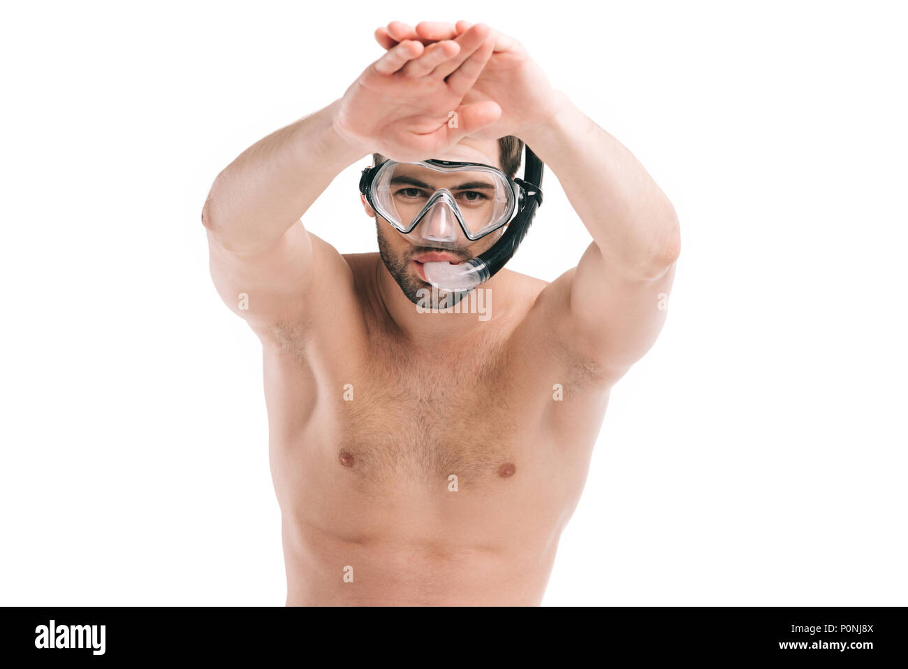 handsome shirtless young man in diving mask swimming and looking at ...