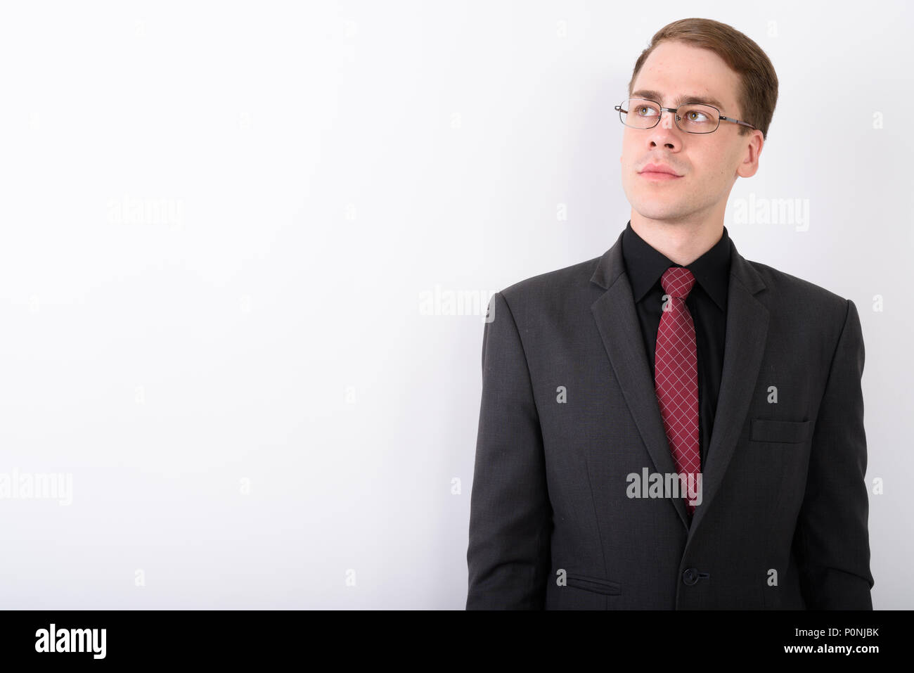 Young handsome businessman wearing suit against white background Stock ...