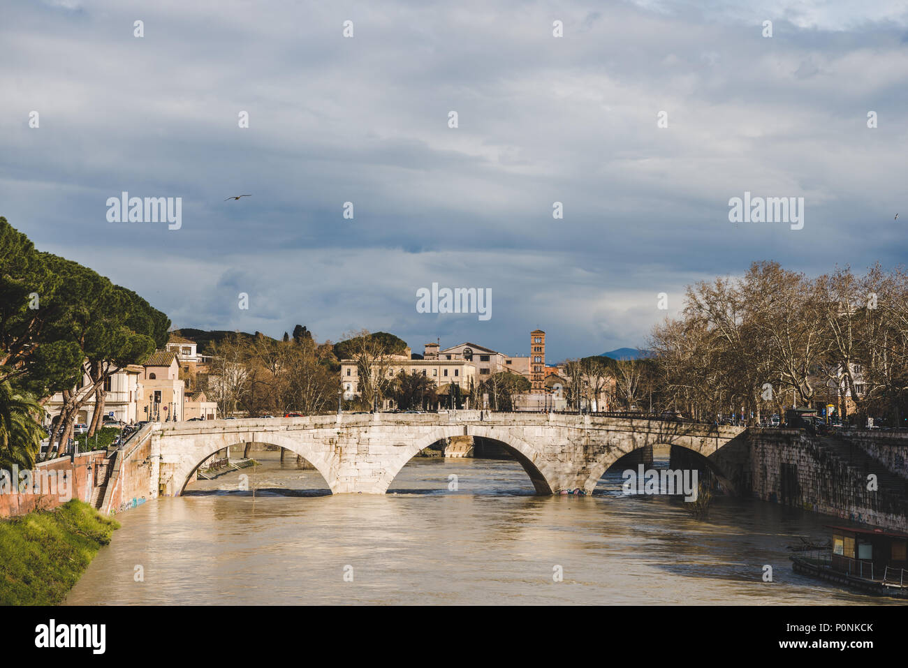 bridge over tiber river on cloudy day, Rome, Italy Stock Photo - Alamy