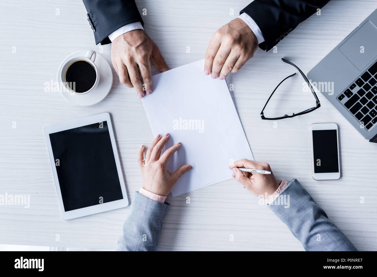 top view of business partners signing contract during meeting Stock ...