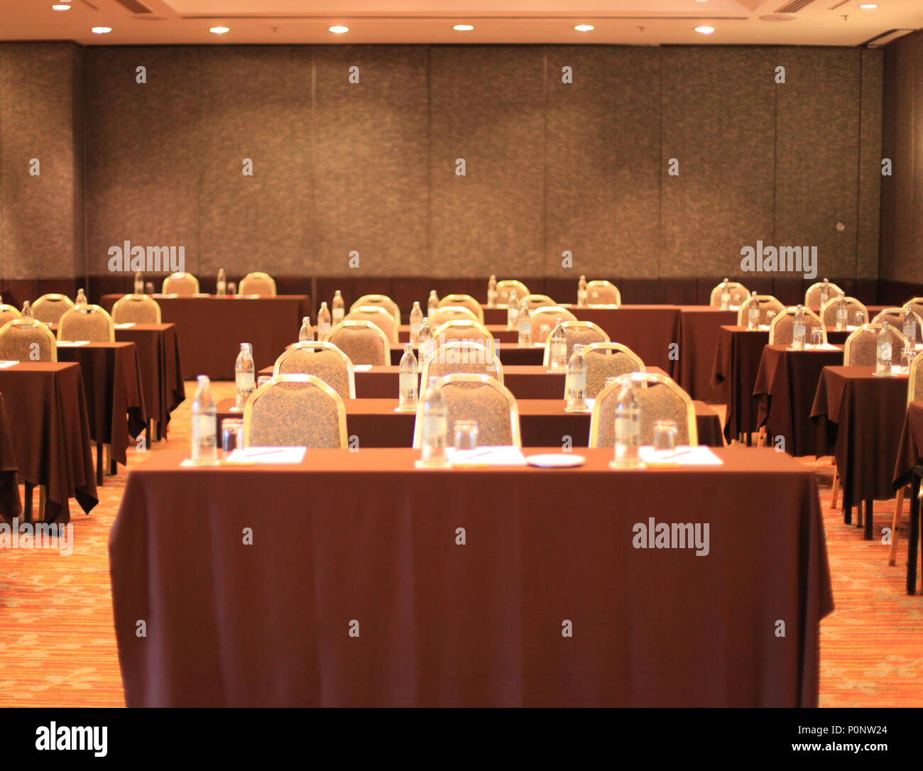 an empty conference meeting room in seminar hall with tables and chairs ...