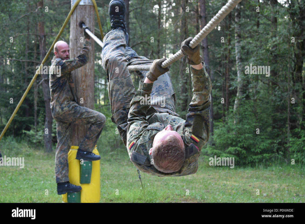 German soldiers with the 3rd Panzer Battalion navigate the obstacle ...