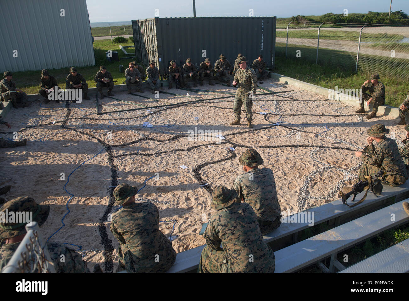 A platoon sergeant with 1st Battalion, 2nd Marines briefs his platoon ...