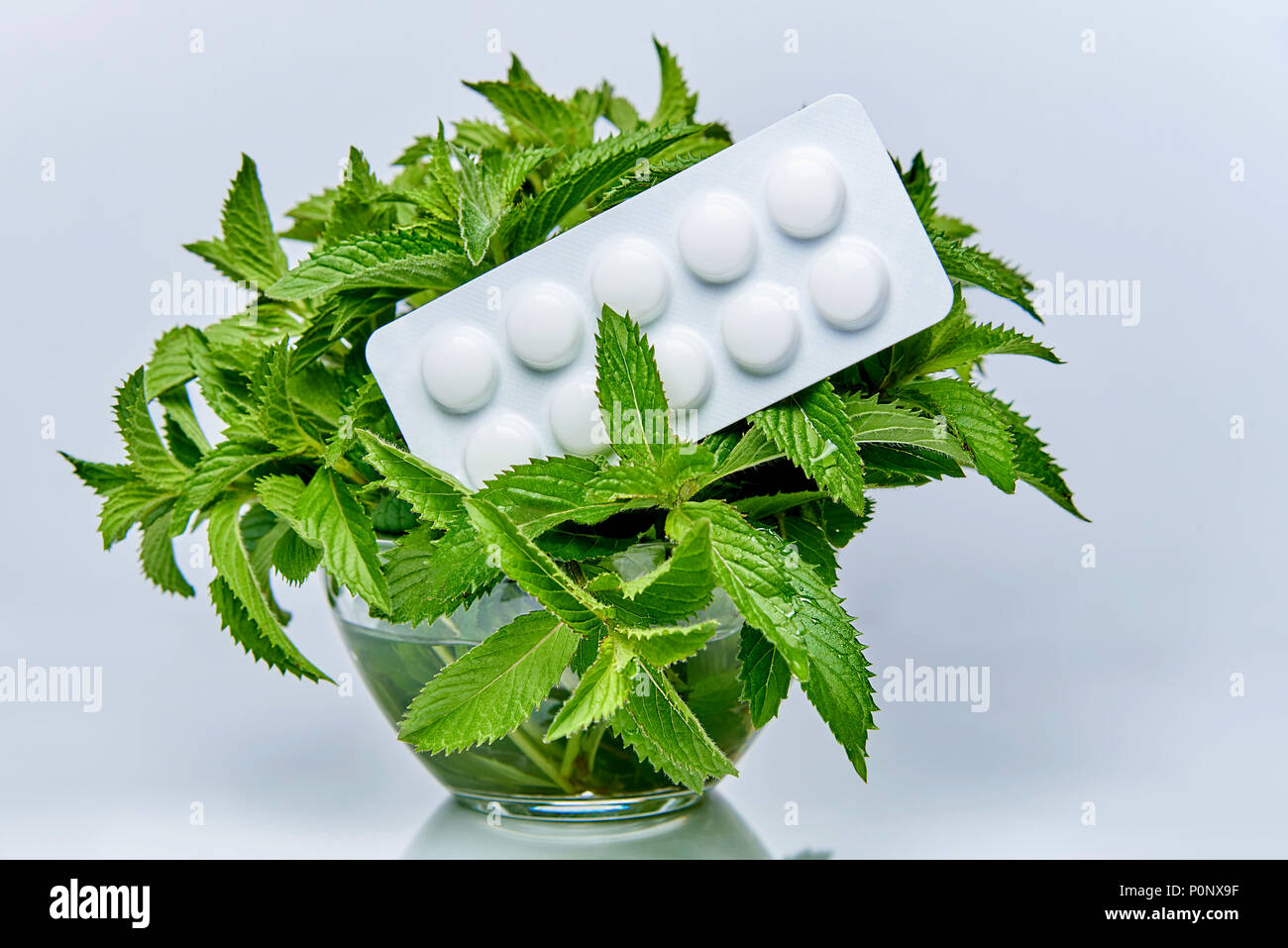 Mint tablets in container hi-res stock photography and images - Alamy