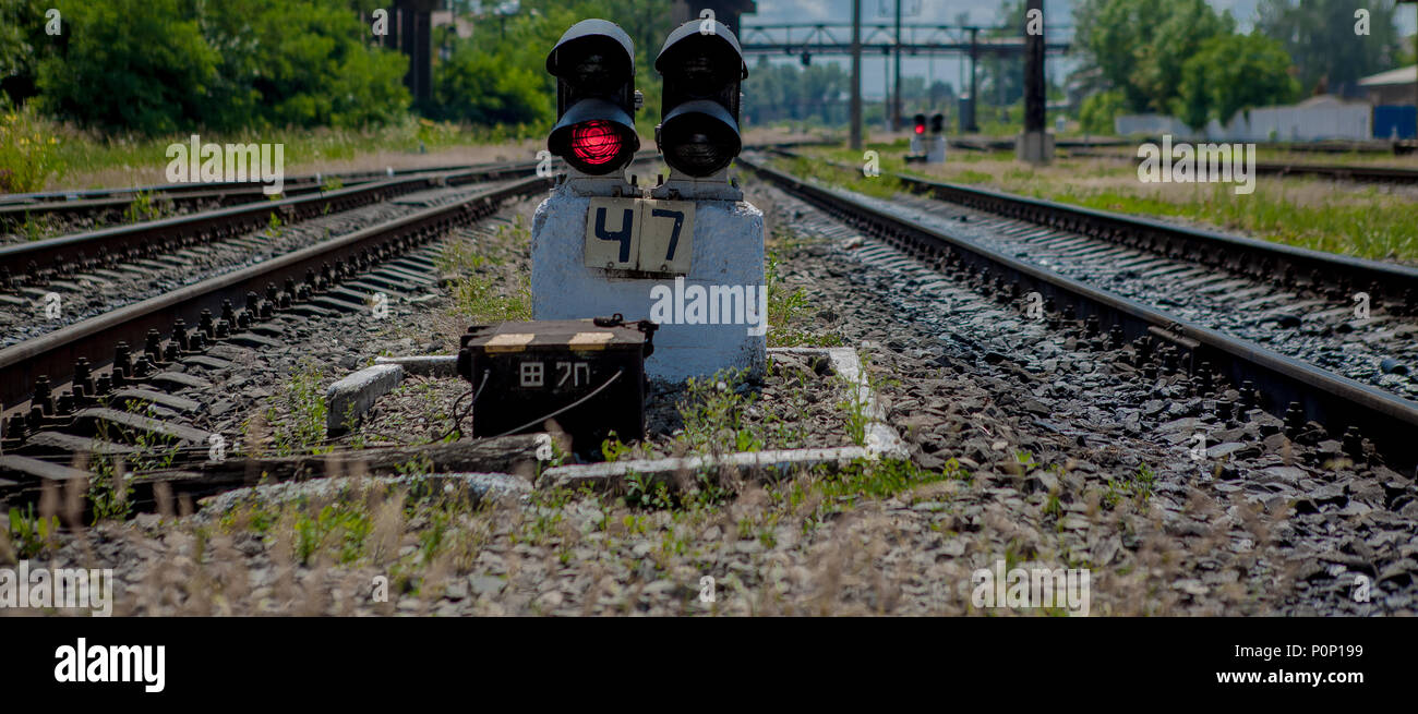 Traffic light shows red signal on railway. Red light. Railway tracks ...