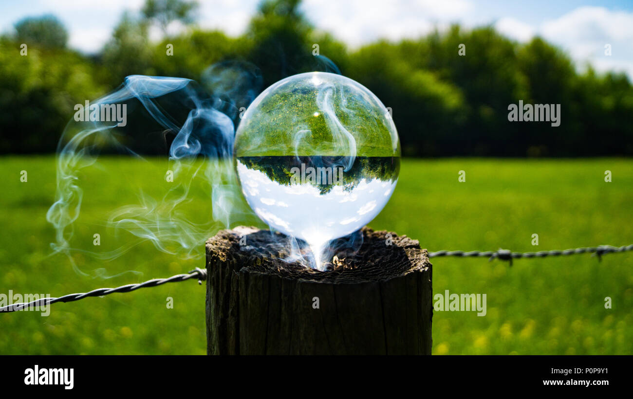 Photo Light Crystal Ball magnifying sun and catching on fire Stock ...