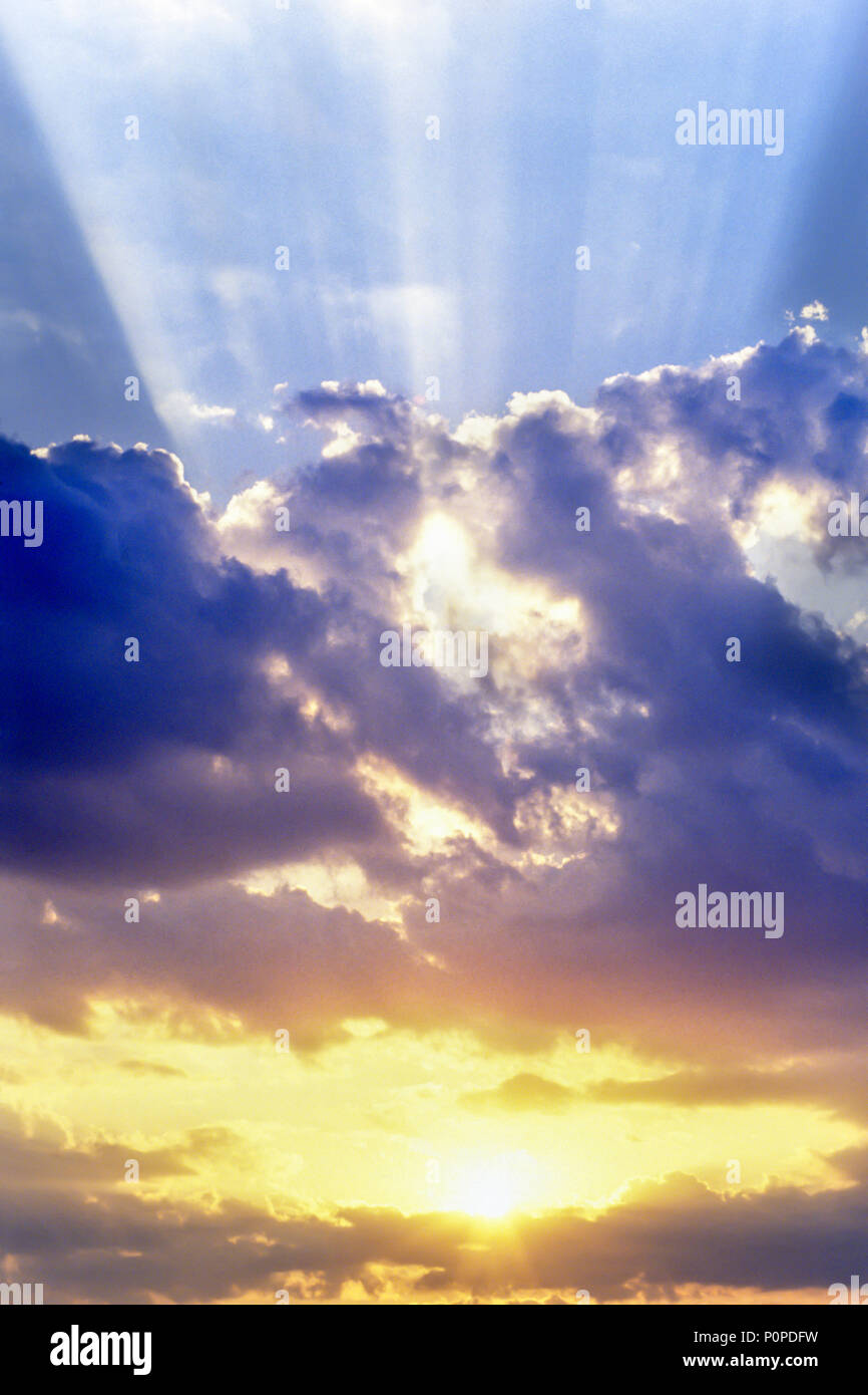 1988 HISTORICAL SUN RAYS THROUGH STORMY CLOUDS Stock Photo - Alamy