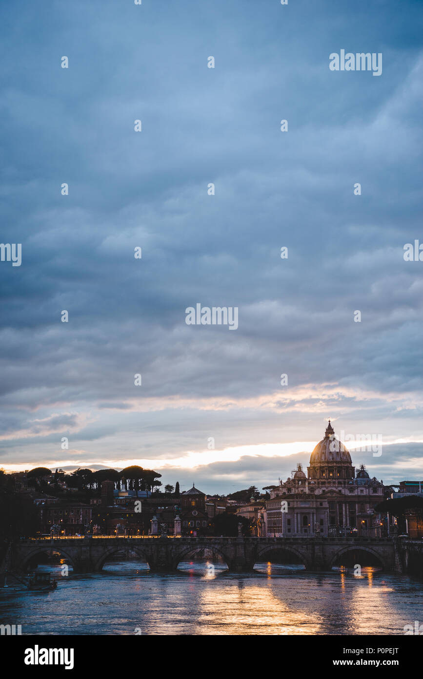 st peters basilica and tiber river during sunset in Rome, Italy Stock ...