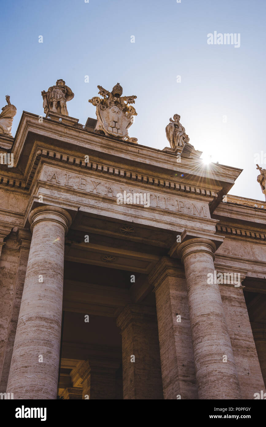 bottom view of statues and arch at St Peters Square in Vatican, Italy ...