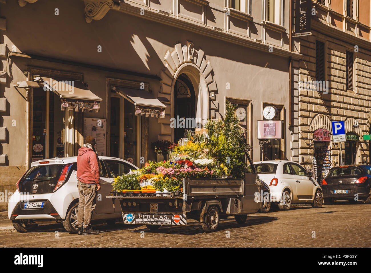 ROME, ITALY - 10 MARCH 2018: man selling flowers from truck on street ...
