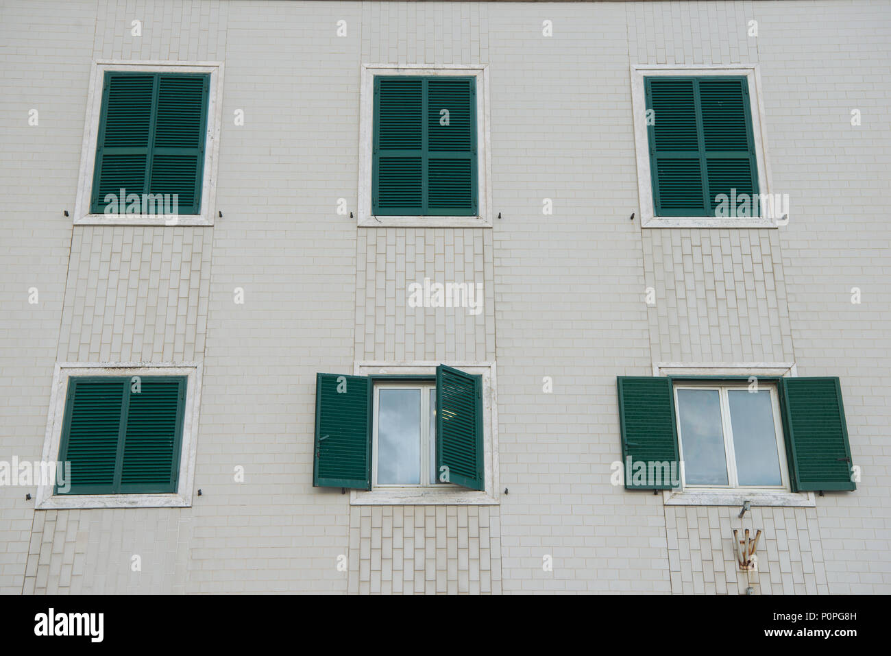 white european building with shuttered windows, Anzio, Italy Stock ...