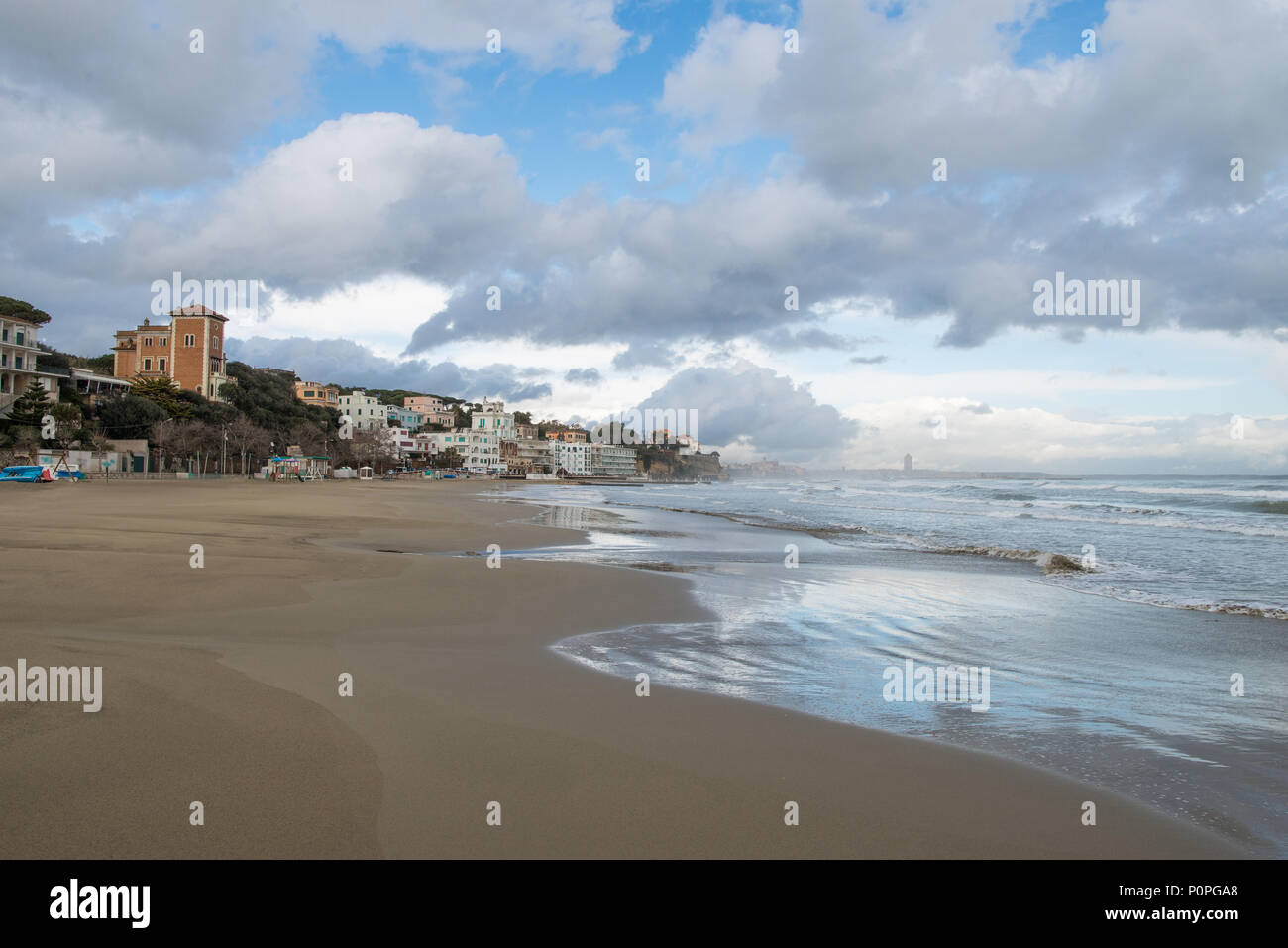 old buildings over coastline on cloudy day, Anzio, Italy Stock Photo ...