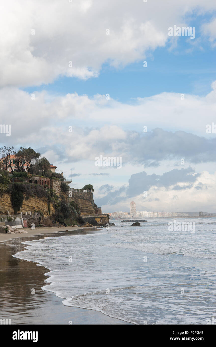 cliff with buildings over sandy beach, Anzio, Italy Stock Photo - Alamy