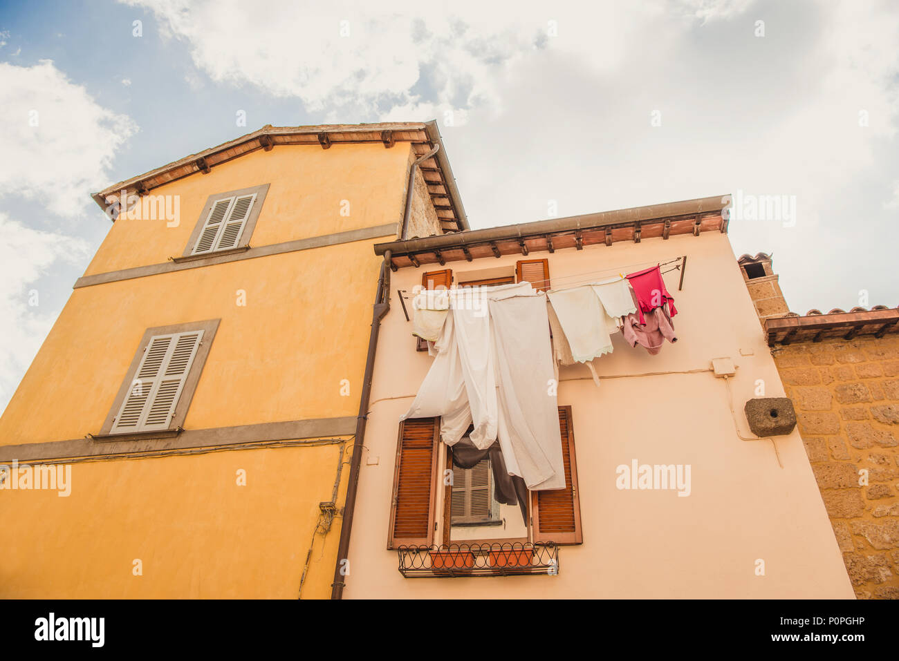 low angle view of clothes drying outside building in Orvieto, Rome ...