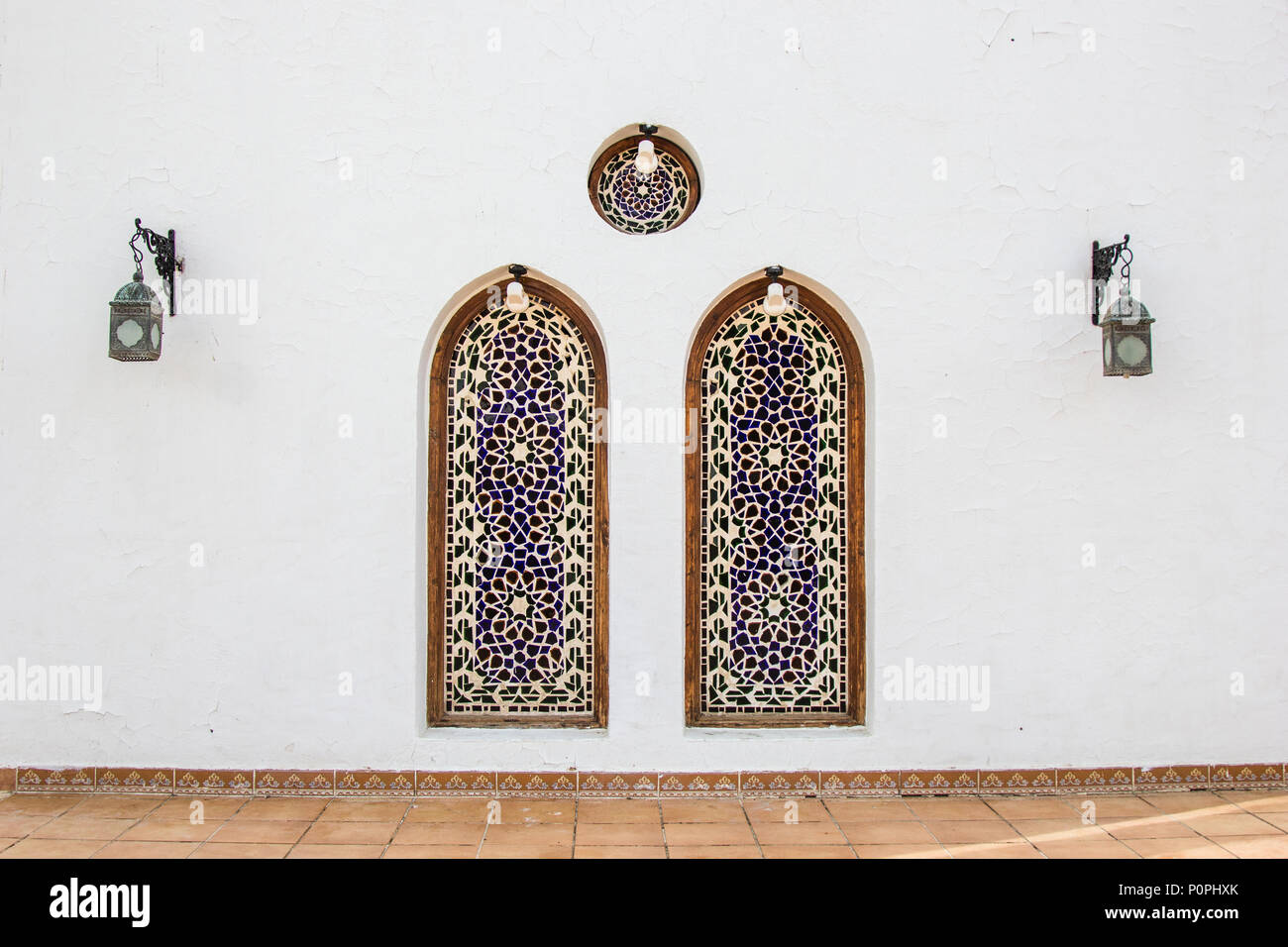 two decorative niches and lanterns on white building in Egypt Stock ...
