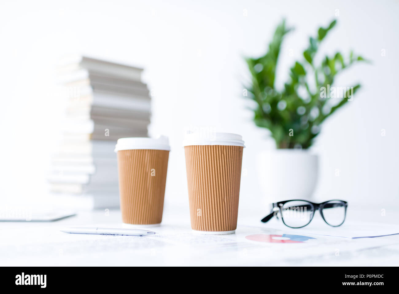paper cups of coffee and business documents composition Stock Photo - Alamy