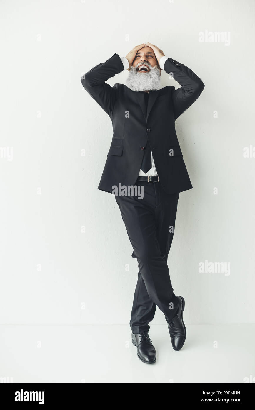 happy loughing senior businessman on white background Stock Photo - Alamy