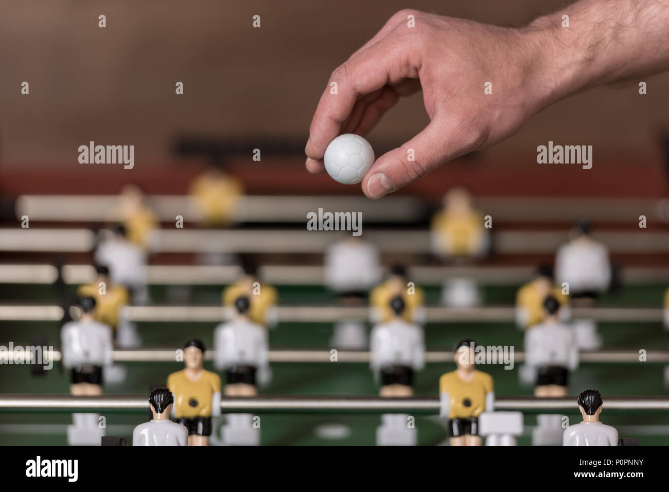 Hand and foosball table hi-res stock photography and images - Alamy