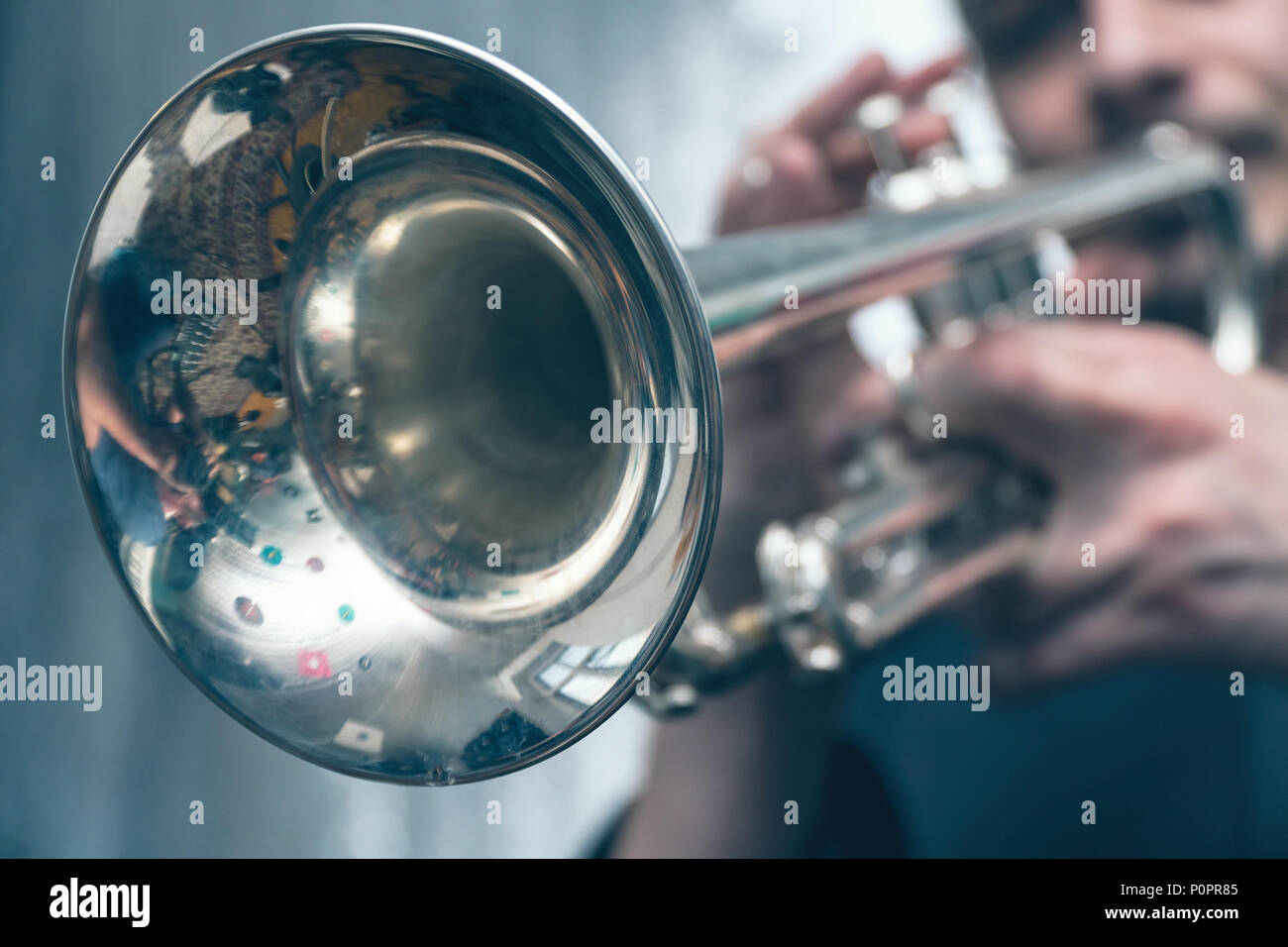 Trumpeter is playing on a silver trumpet Stock Photo - Alamy