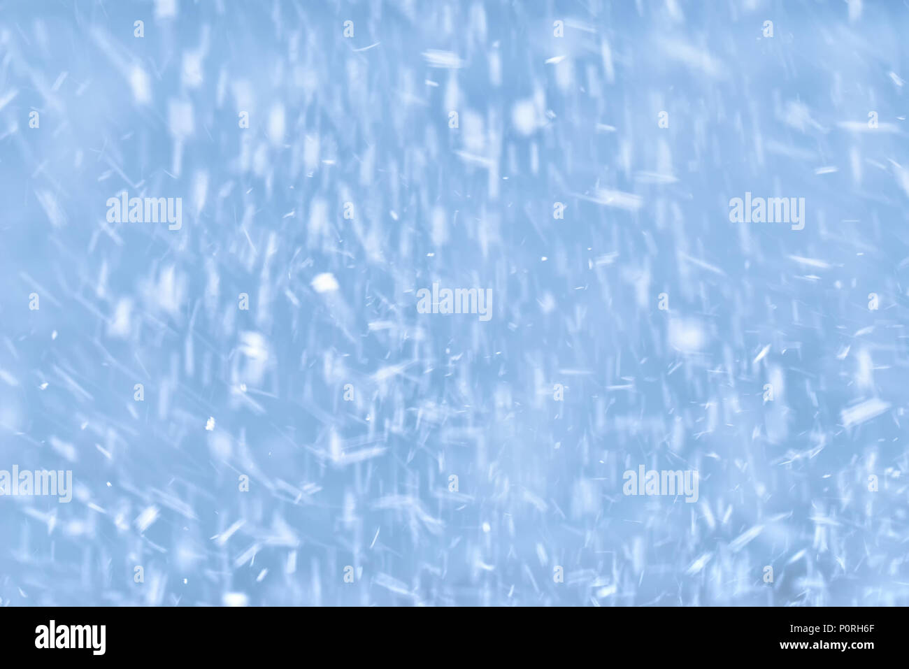 Falling snow on a blue background. Winter blue sky with falling snow ...