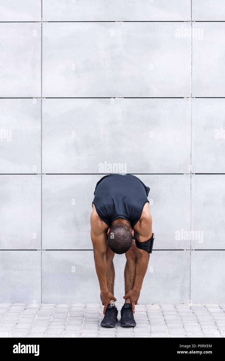African american jogger stretching legs hi-res stock photography and ...