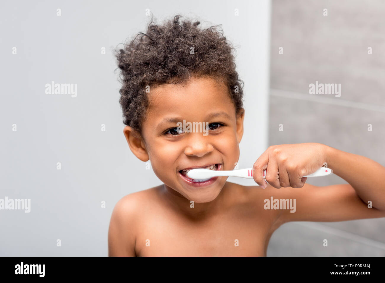 Black Child Brushing Teeth