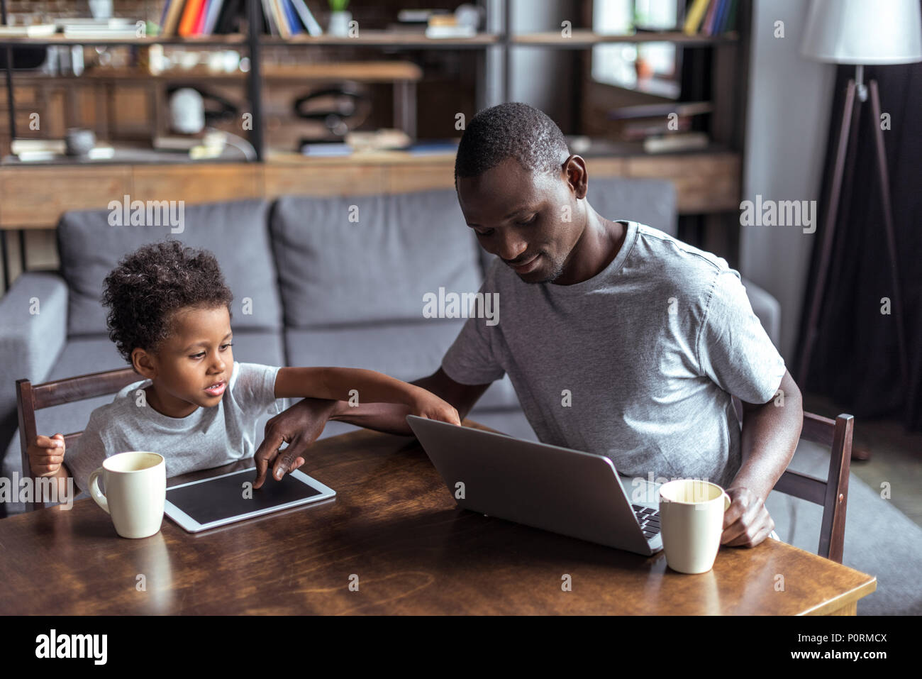 Father son using computers hi-res stock photography and images - Alamy