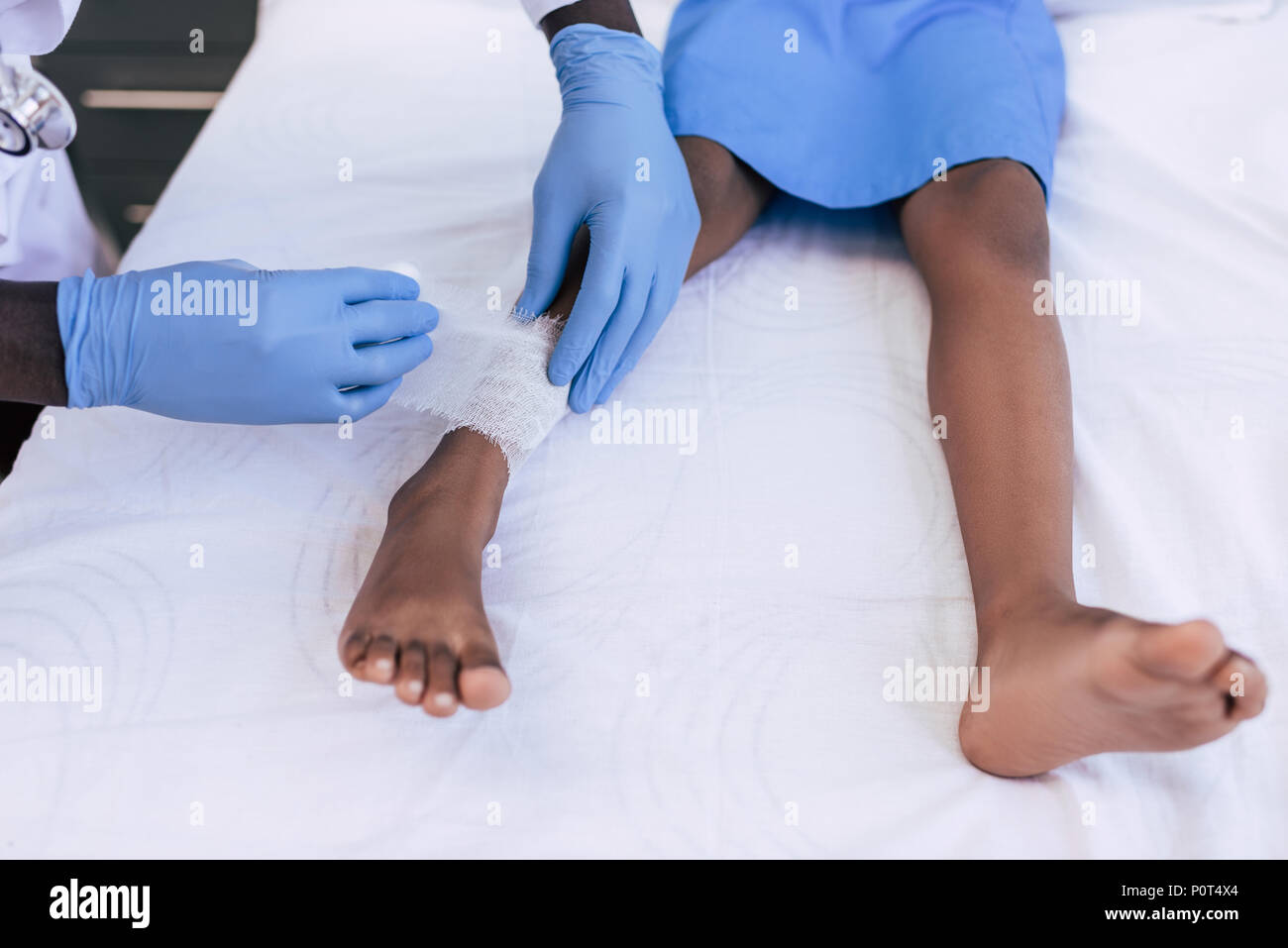 Boy putting on coat hi-res stock photography and images - Alamy