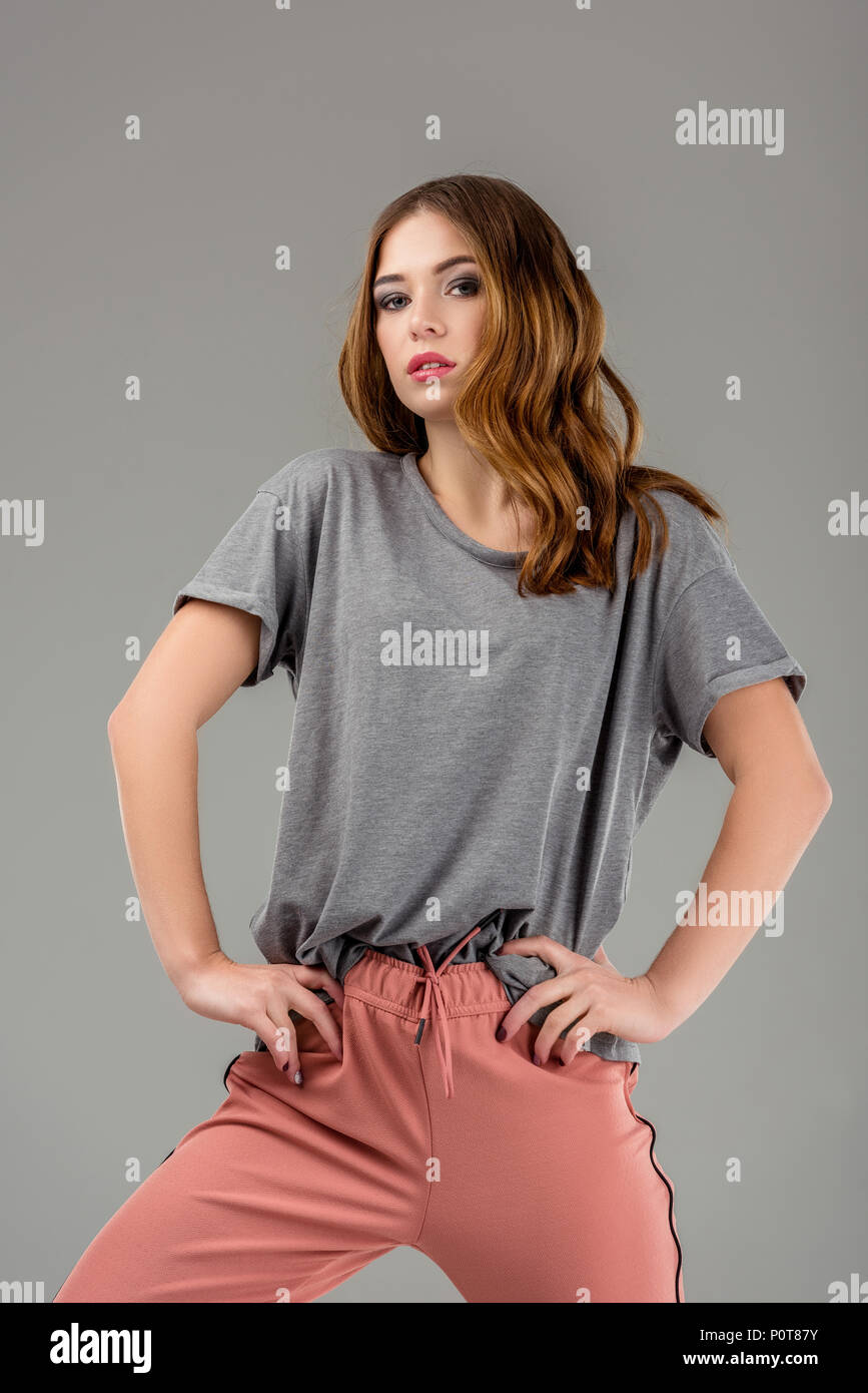 Woman standing akimbo hi-res stock photography and images - Alamy