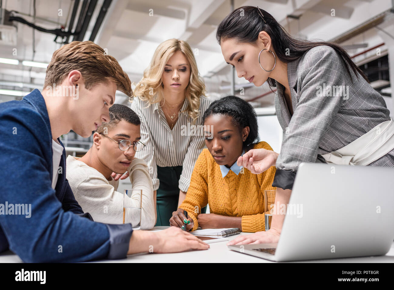 concentrated business partners working together at conference hall ...