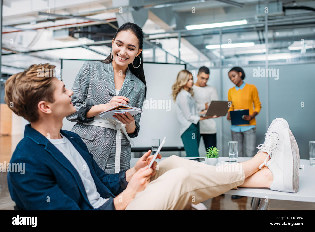 young beautiful secretary talking with boss and making notes Stock ...