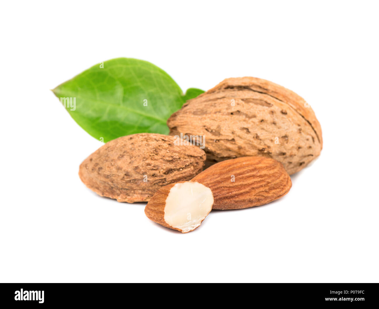 Nuts almonds with leaf on a white background Stock Photo - Alamy