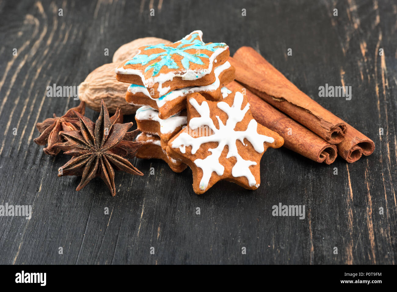 Christmas gingerbread snowflakes with spices on table close-up Stock ...