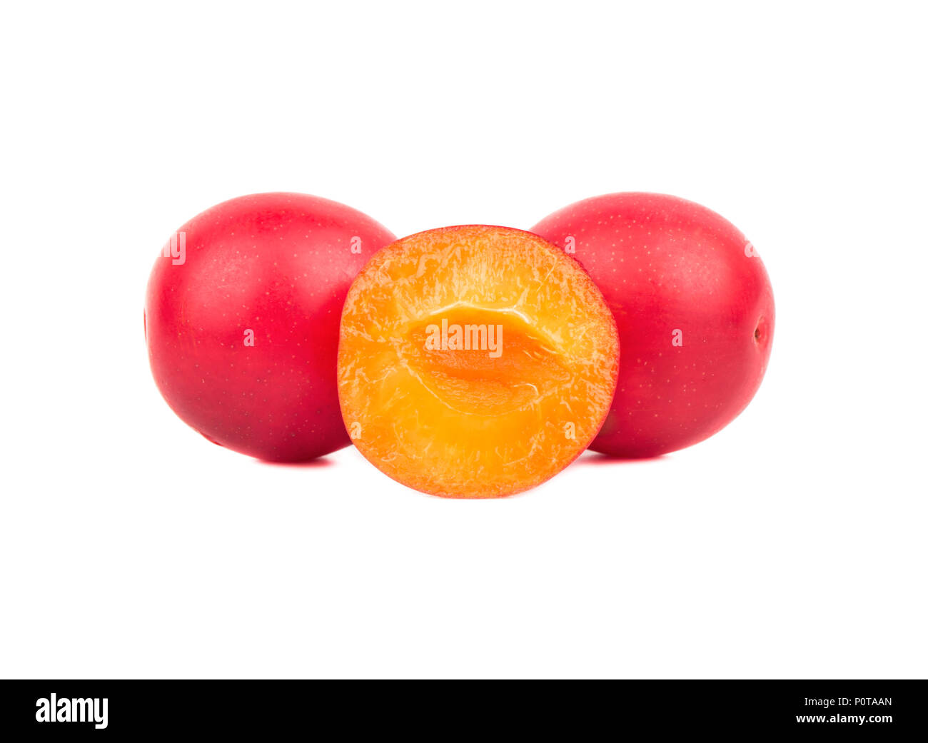 Fresh red cherry plum with half on white background Stock Photo - Alamy