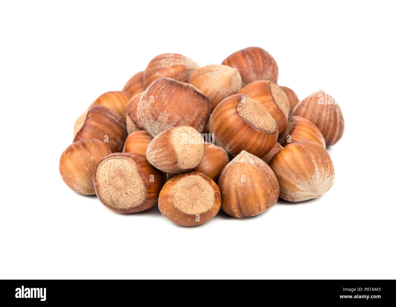 Heap raw hazelnuts in shell on a white background Stock Photo - Alamy