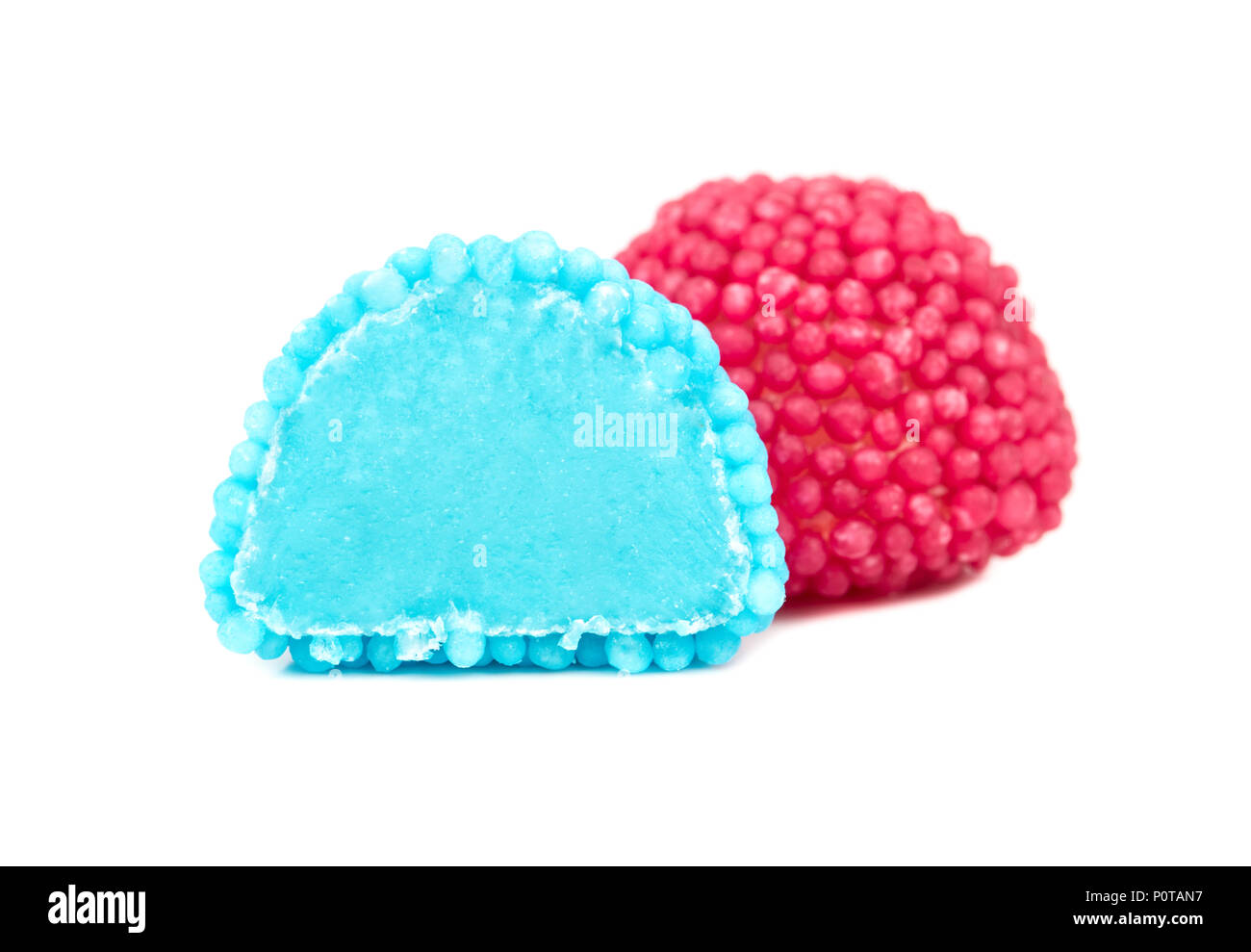 Red berry jelly candy with blue half on a white background Stock Photo ...